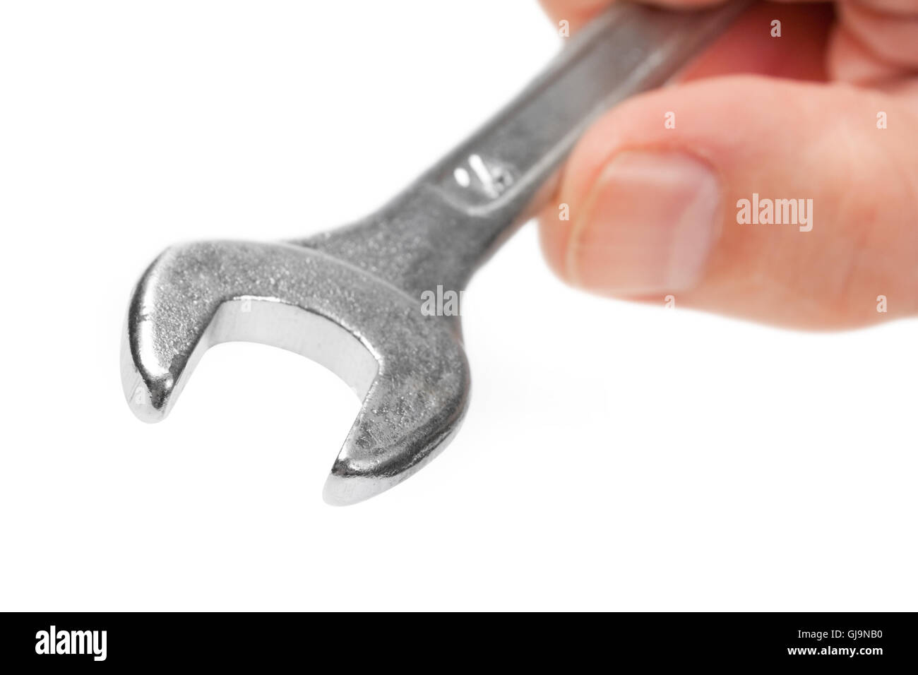 spanner in hand Stock Photo - Alamy