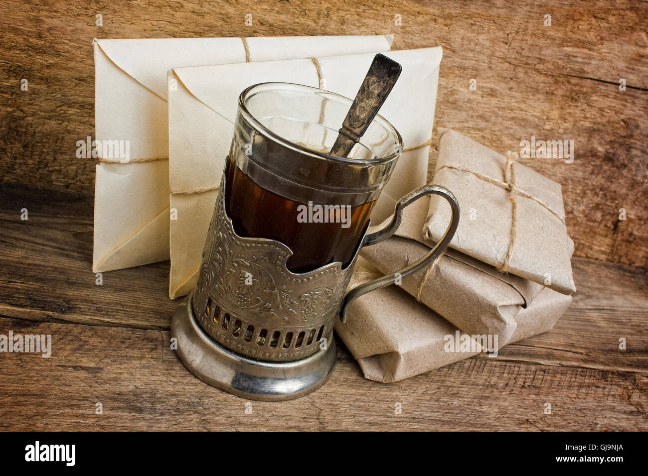 Postage on the background of an old board Stock Photo - Alamy