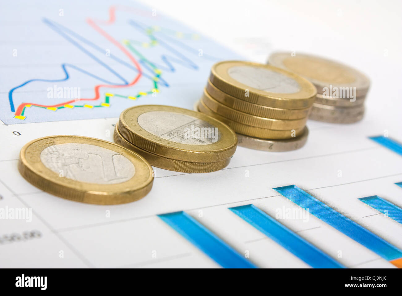 charts and coins Stock Photo - Alamy
