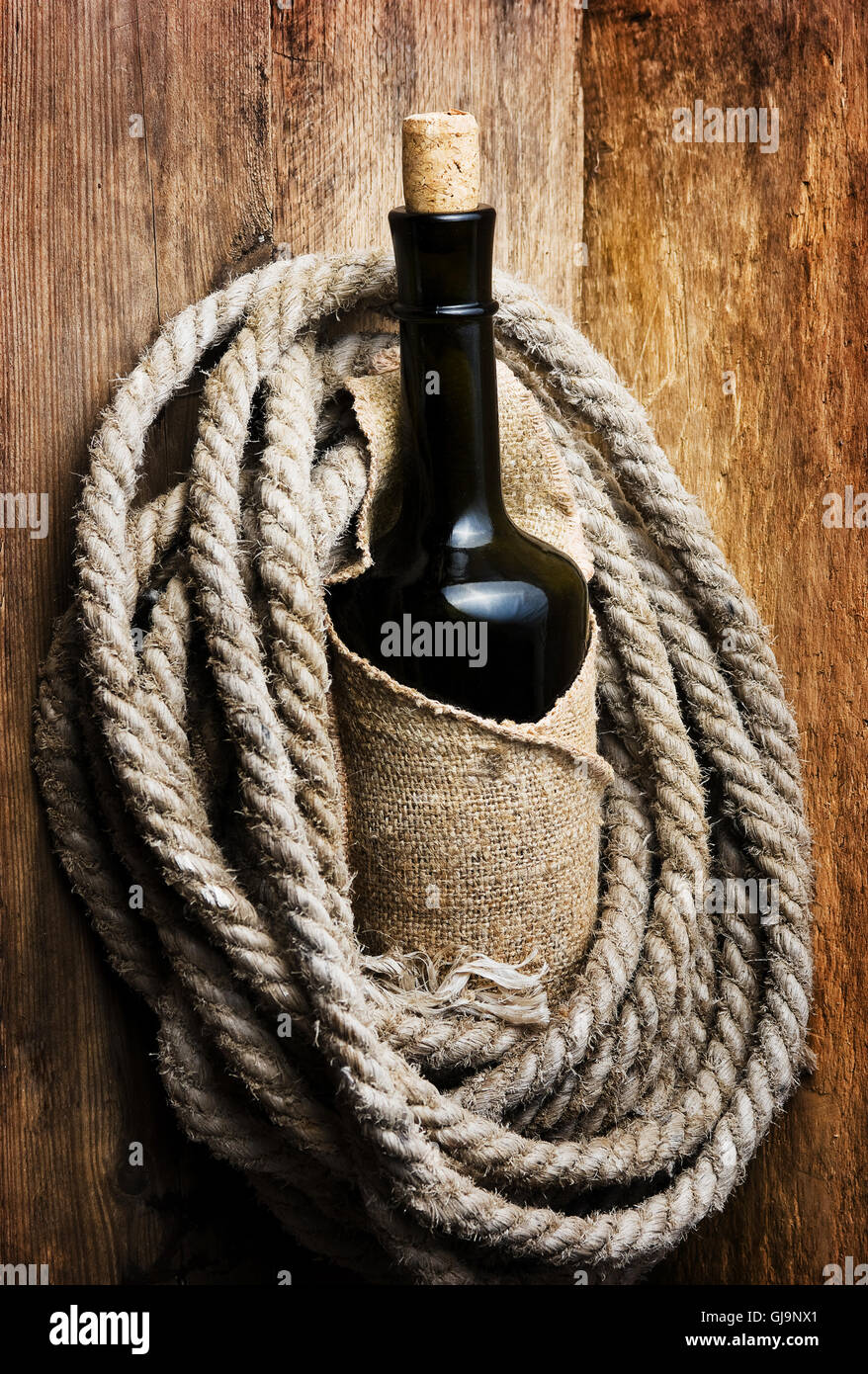 bottle wrapped with rope Stock Photo - Alamy