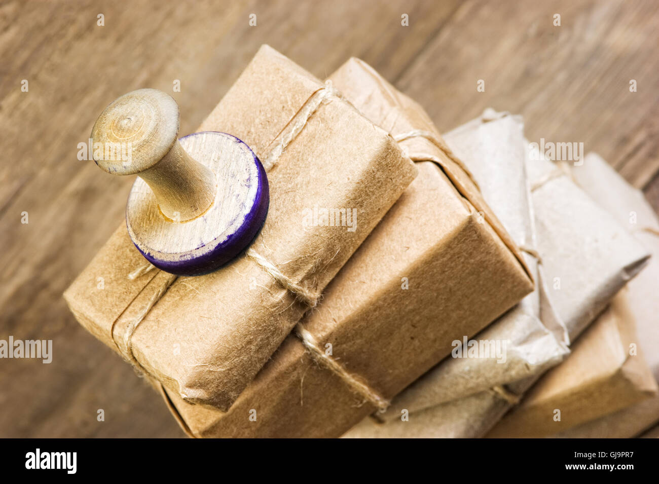 Postage on the background of an old board Stock Photo - Alamy
