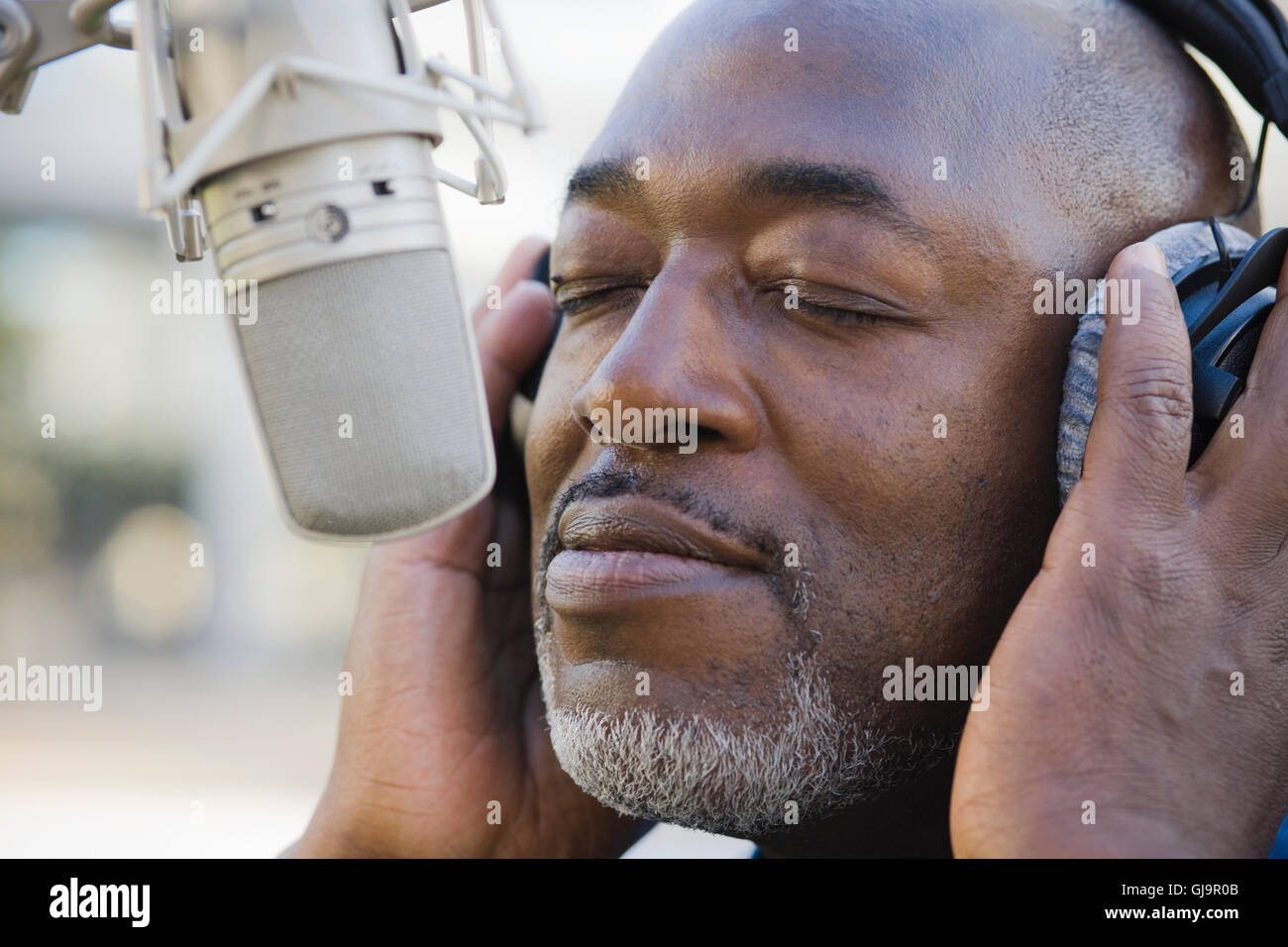 Man in Front of Microphone Stock Photo - Alamy