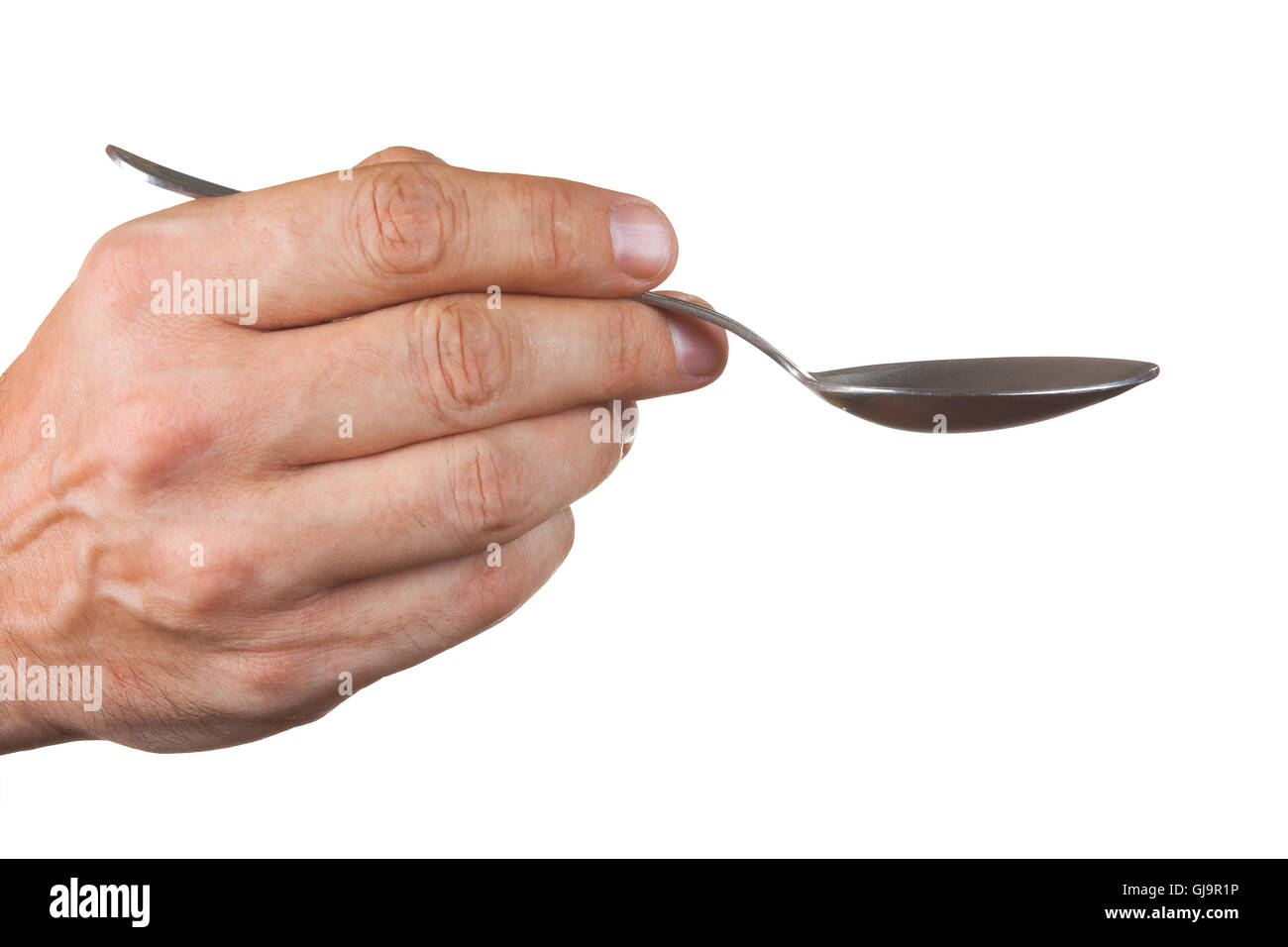 spoon in hand Stock Photo - Alamy