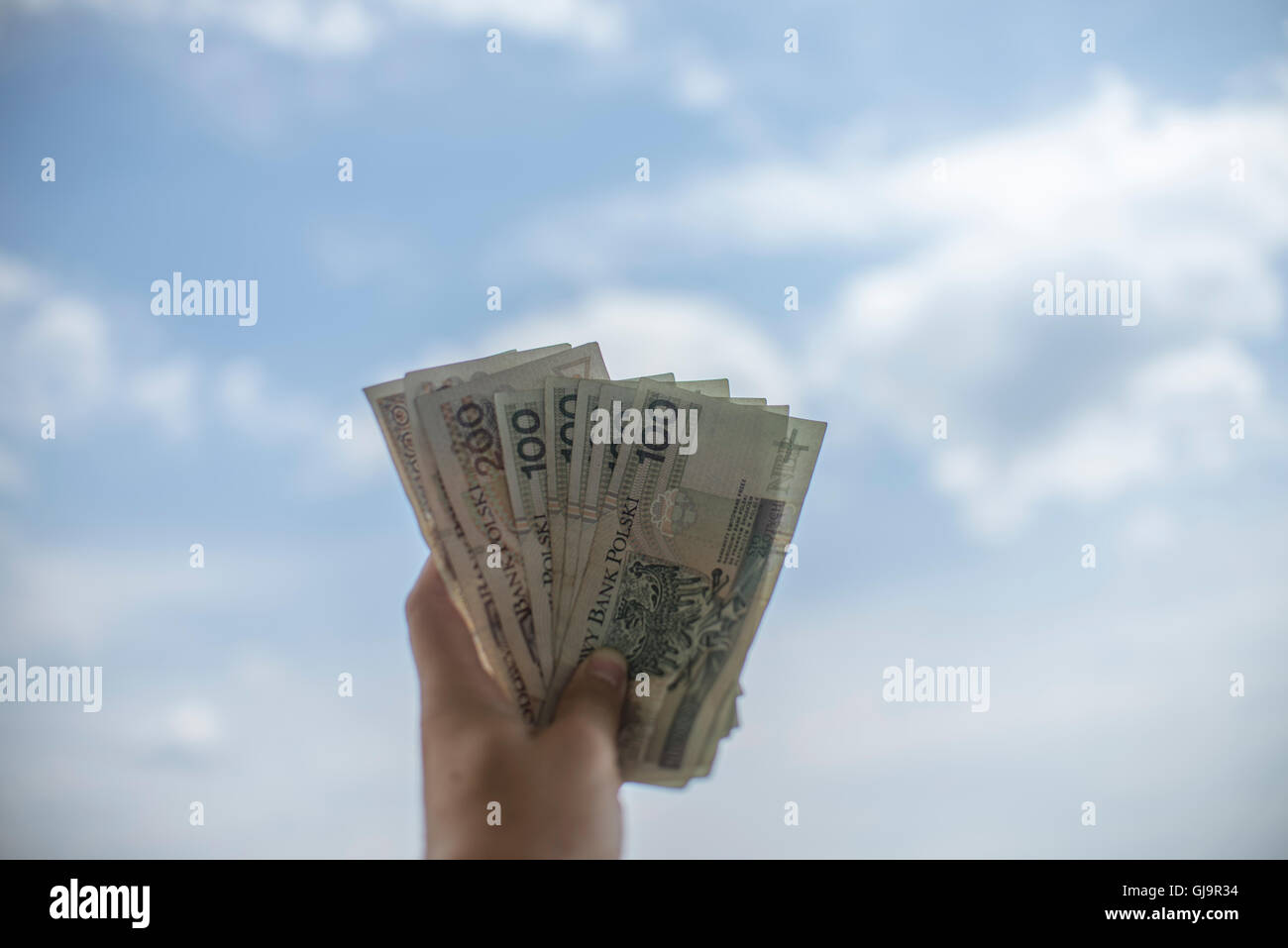 Polish banknotes falling from sky Stock Photo - Alamy