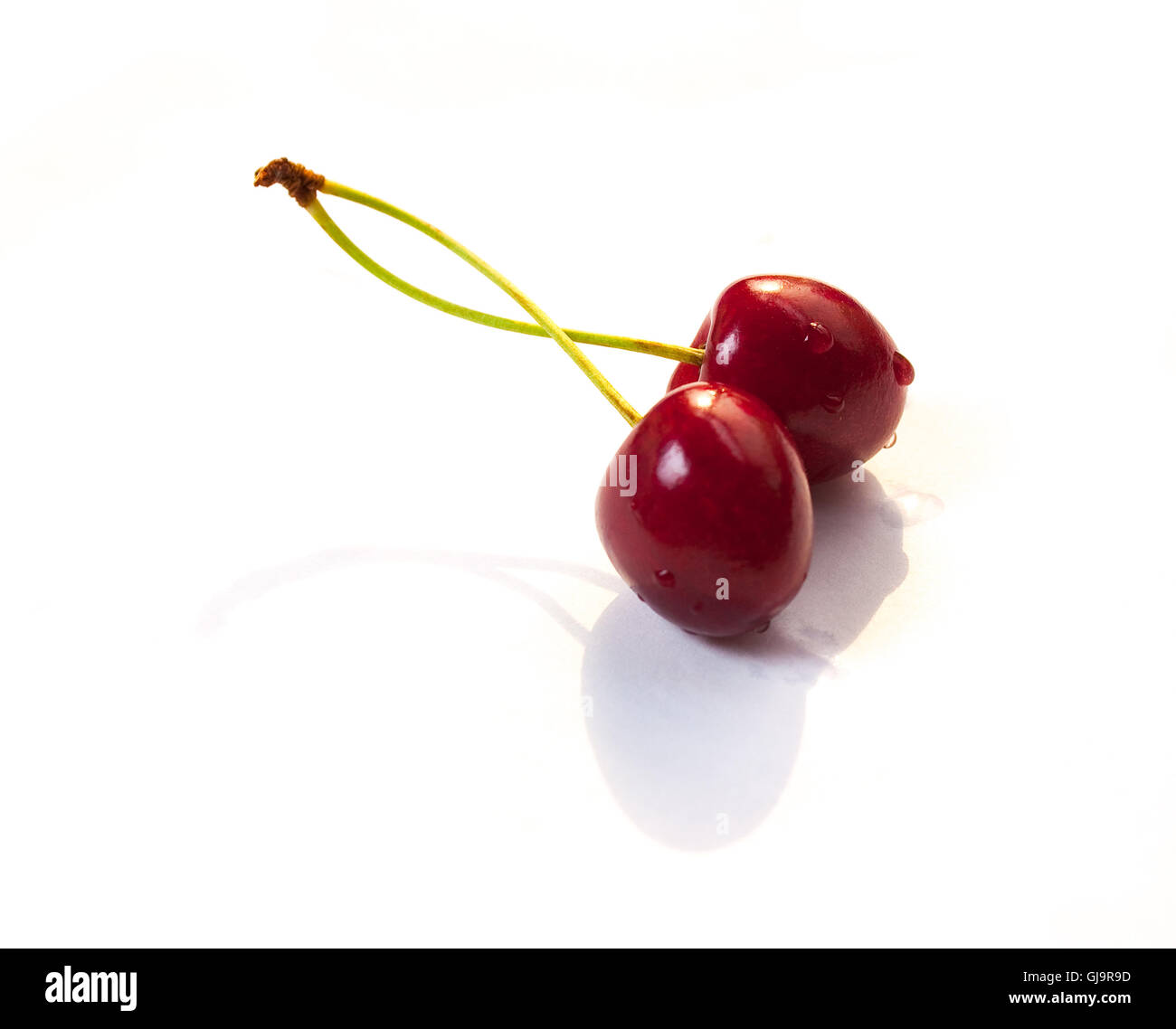 Cherries isolated white background Cut Out Stock Images & Pictures - Alamy