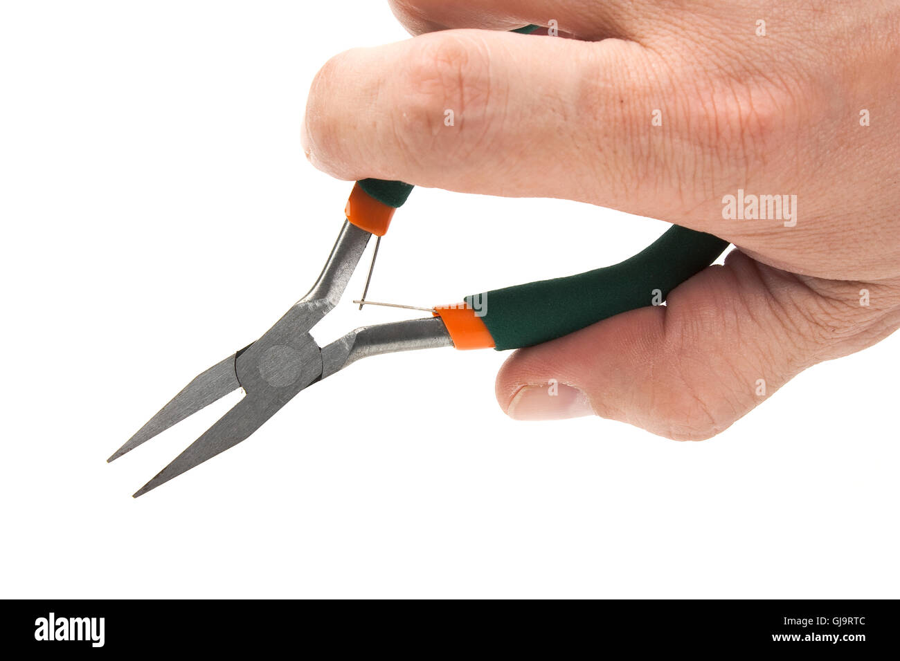 Pliers in hand Stock Photo - Alamy