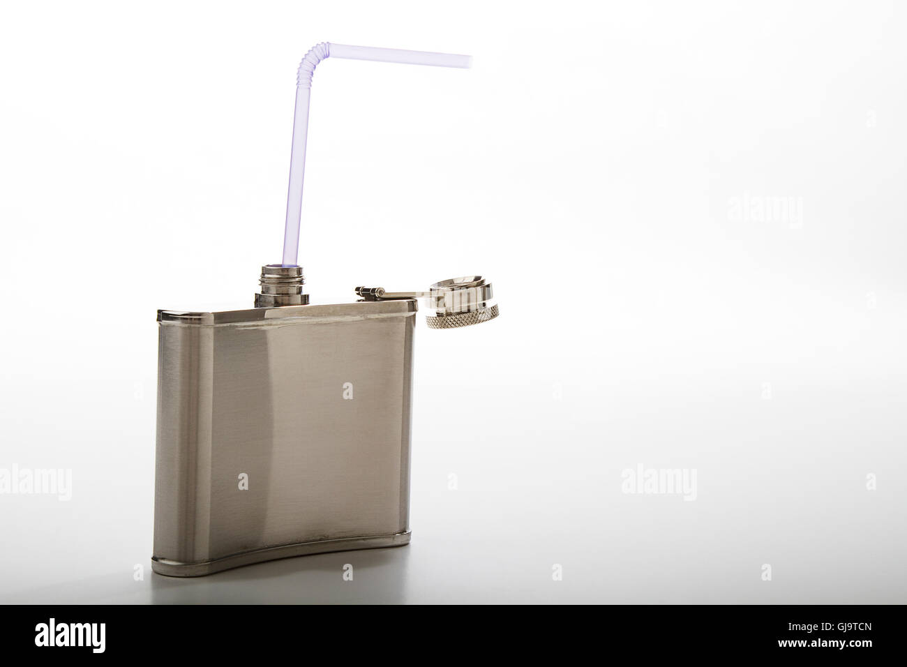 A flask and a straw Stock Photo - Alamy