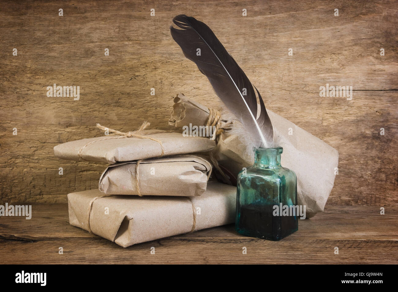 Postage on the background of board Stock Photo - Alamy