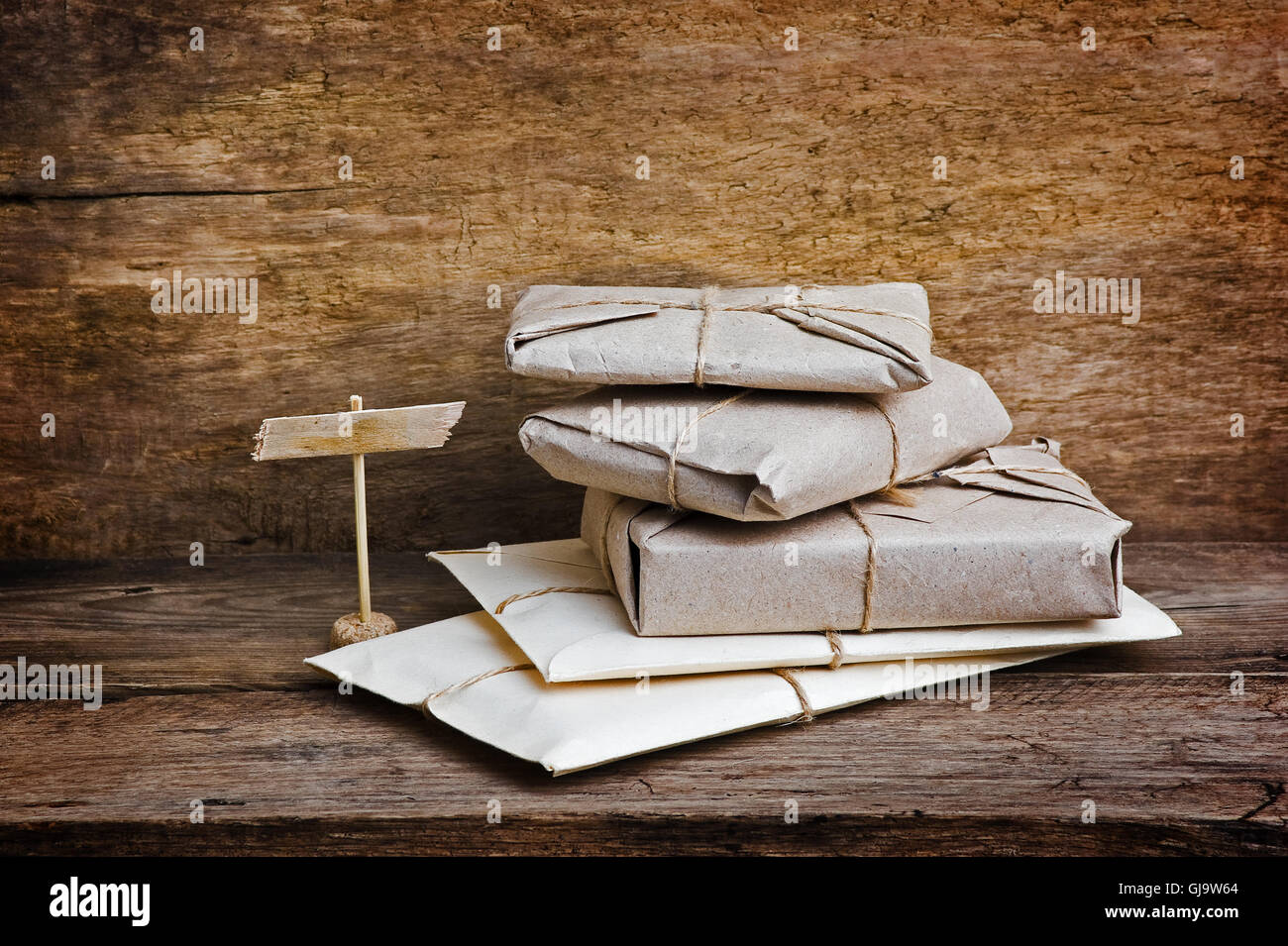Postage on the background of an old board Stock Photo - Alamy
