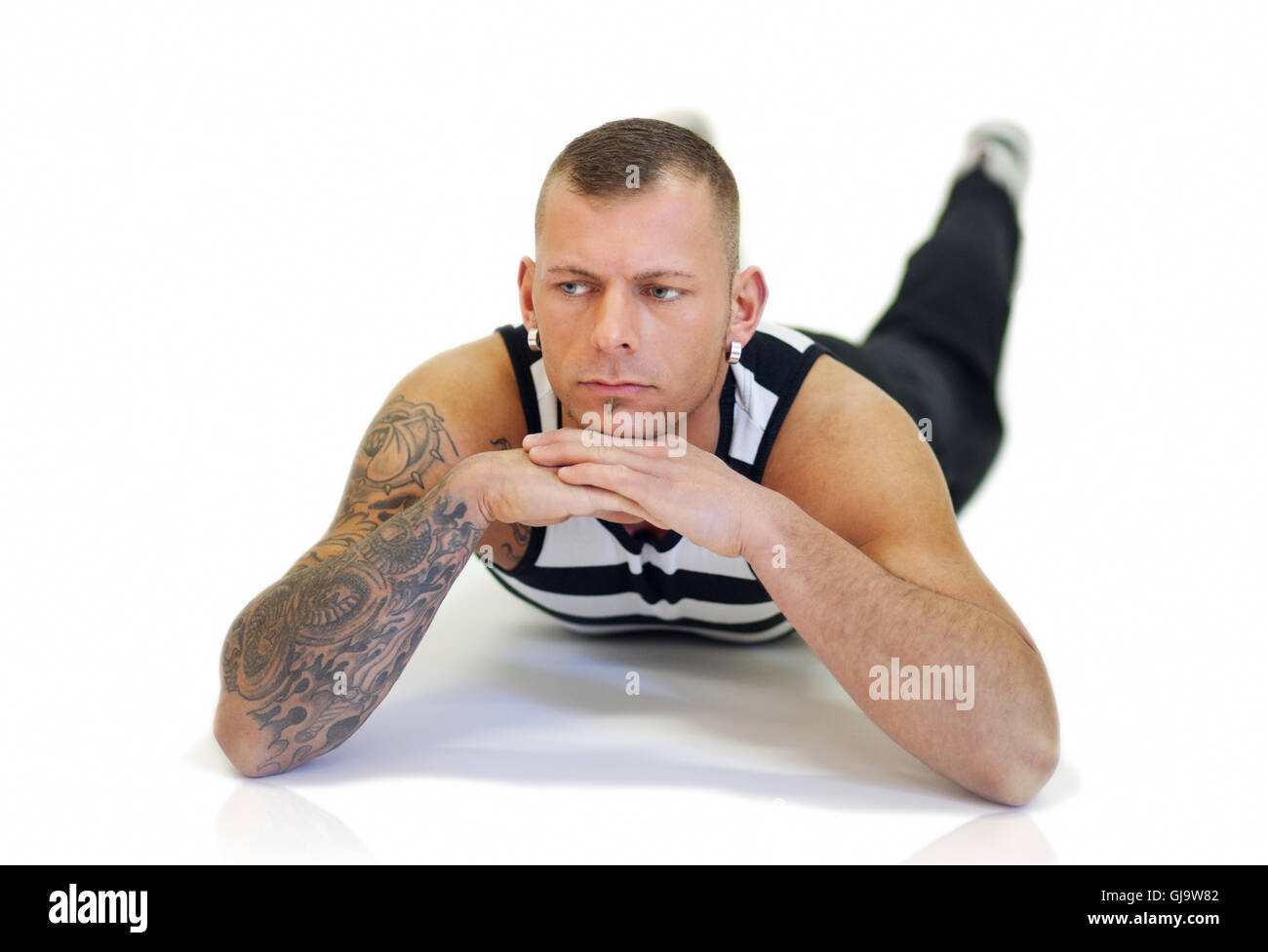 Gym exercise man lying Cut Out Stock Images & Pictures - Alamy