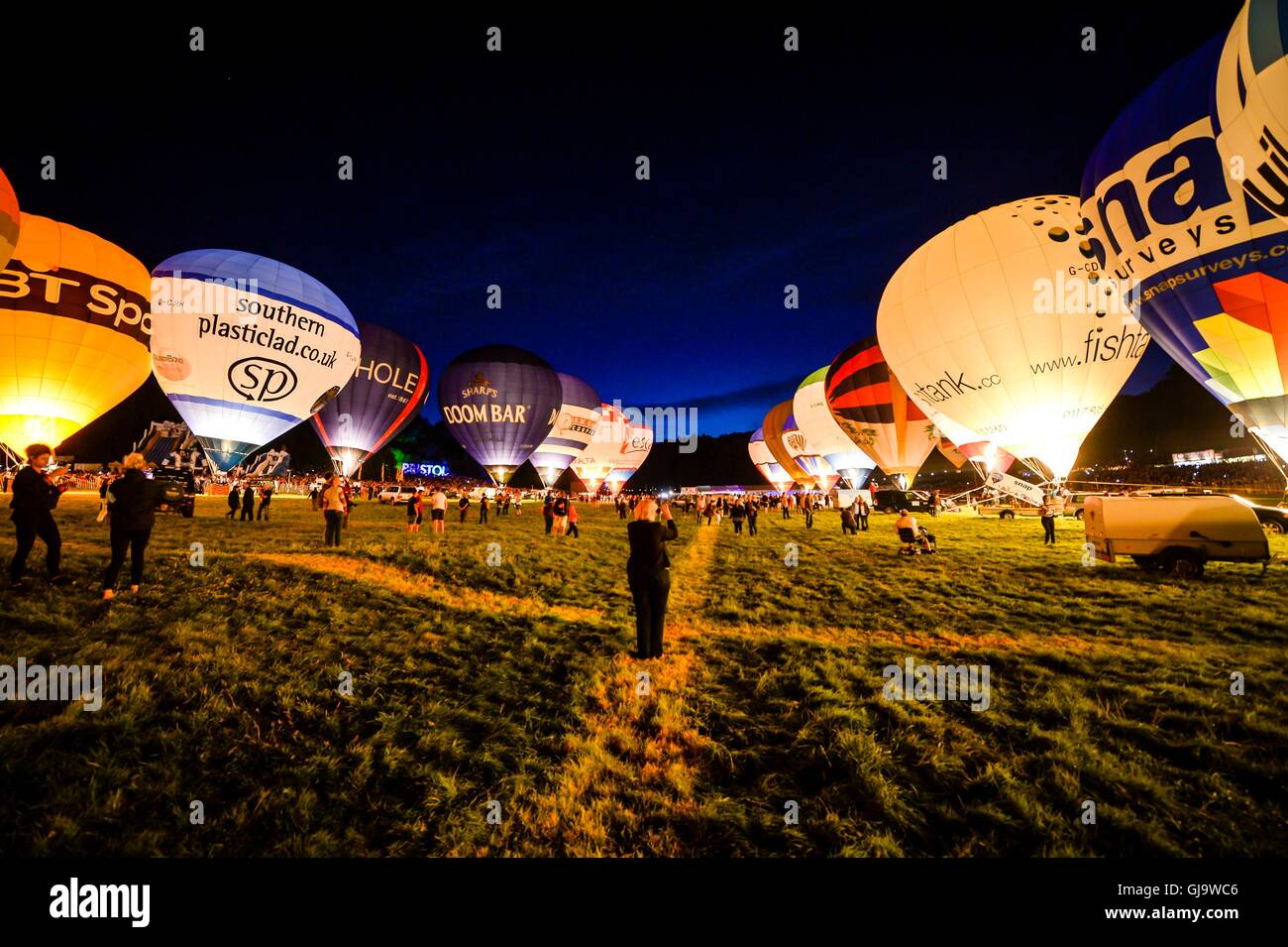 A woman photographs hot air balloons hi-res stock photography and ...