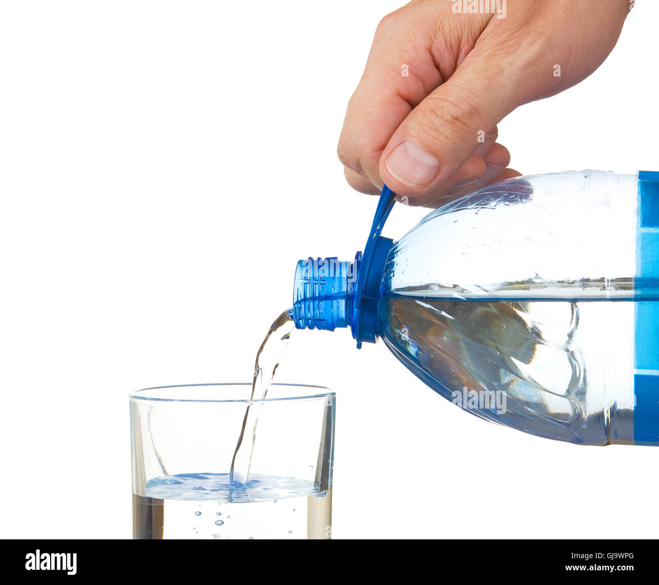 pouring water from a bottle into a glass Stock Photo - Alamy