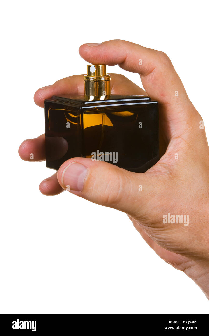 bottle of cologne in his hand Stock Photo - Alamy