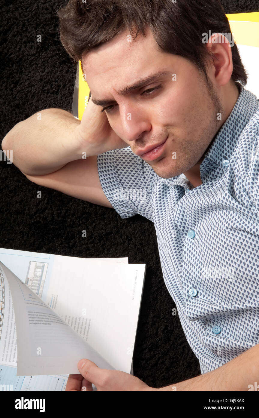Student man with his book in camera Stock Photo - Alamy