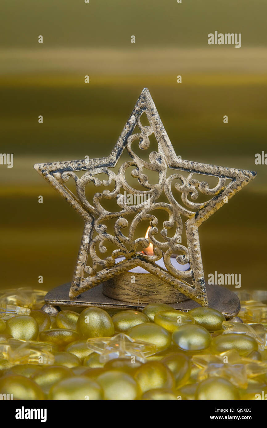 Gold Christmas Star shaped tea light holder with Yellow clear gl Stock ...