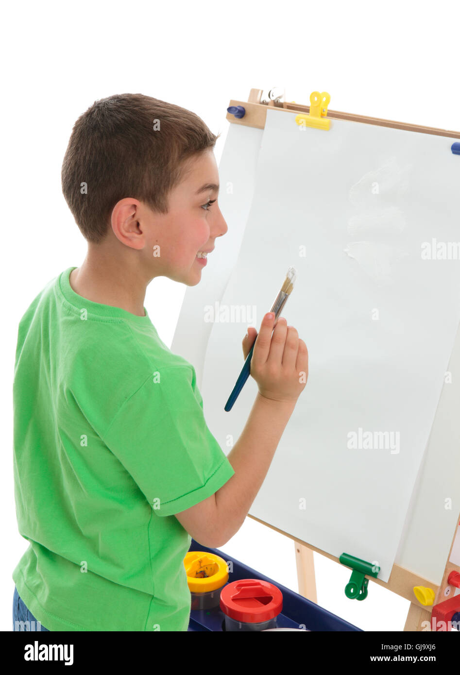 Boy reading to paint Stock Photo - Alamy