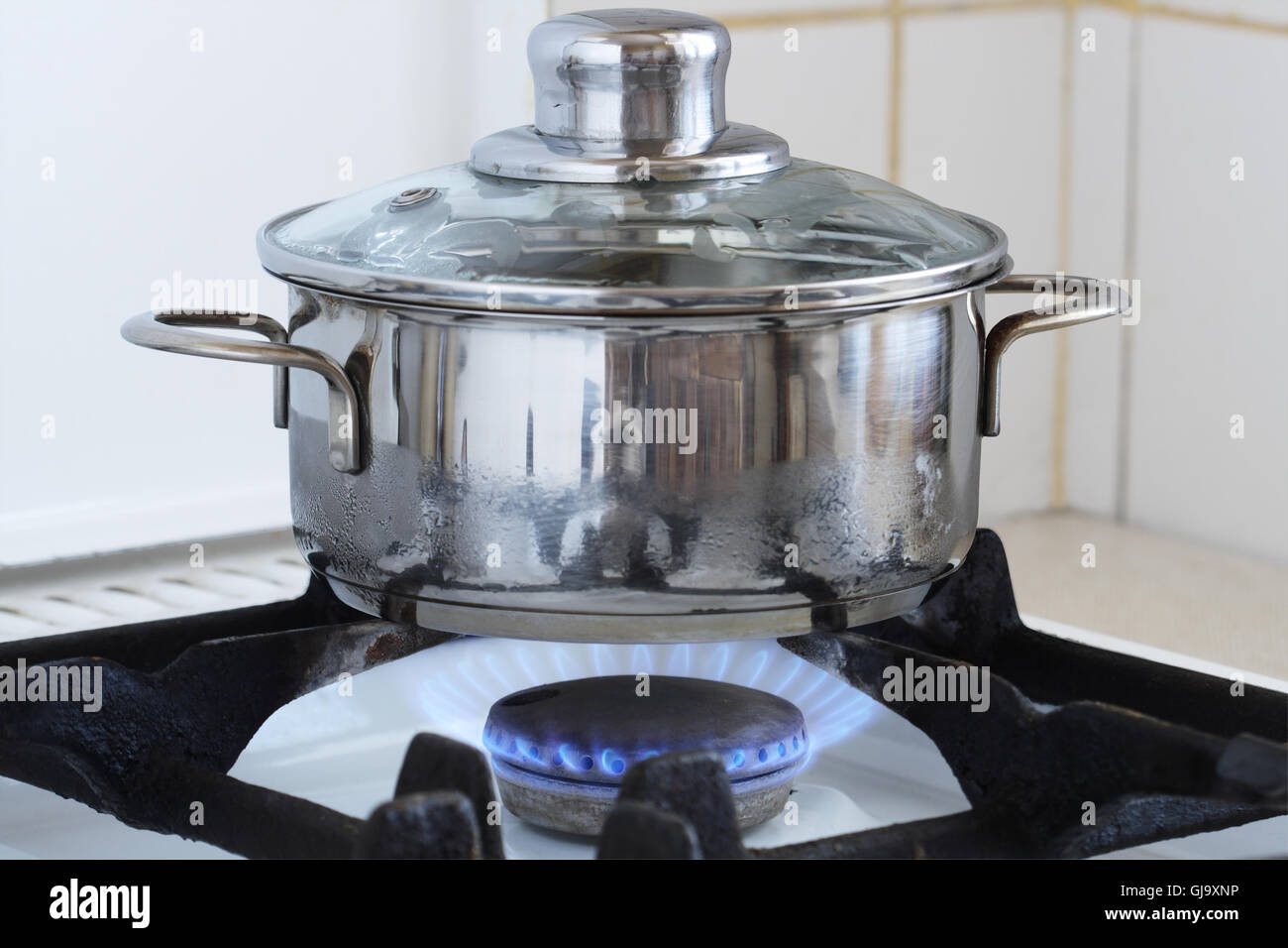Pan On Kitchen Stove Stock Photo - Alamy