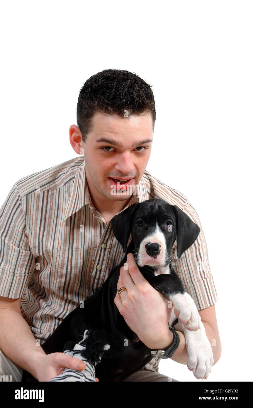 Young man and his puppy dog Stock Photo - Alamy