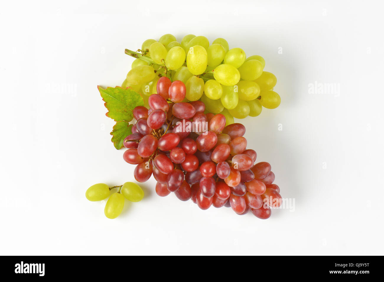 bunches of red and white grapes on white background Stock Photo - Alamy