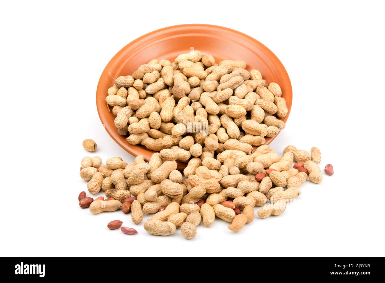 Groundnut in plate isolated on white background Stock Photo - Alamy