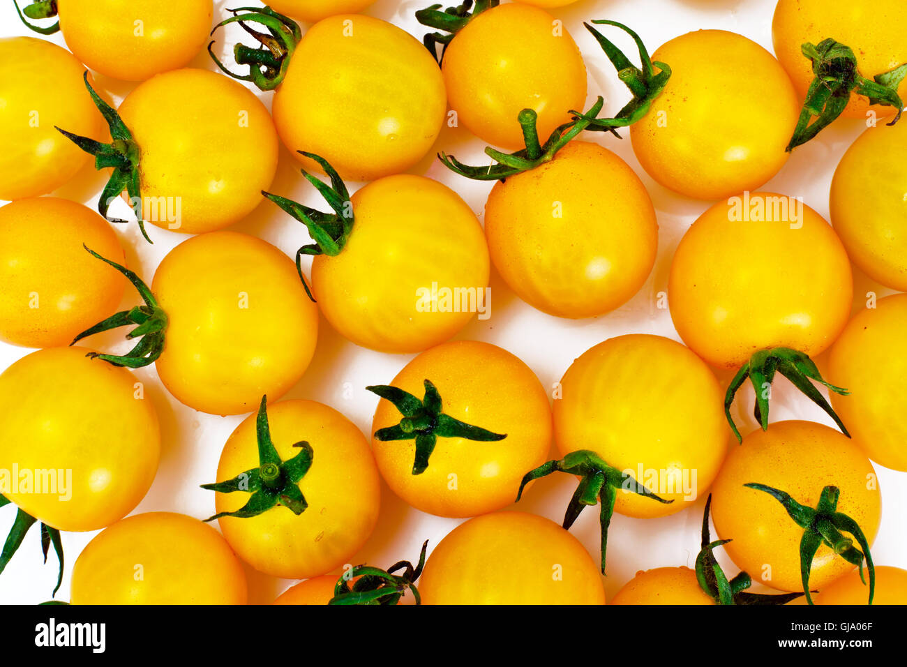 Fresh Yellow Cherry Tomato on Whyite Background Stock Photo - Alamy