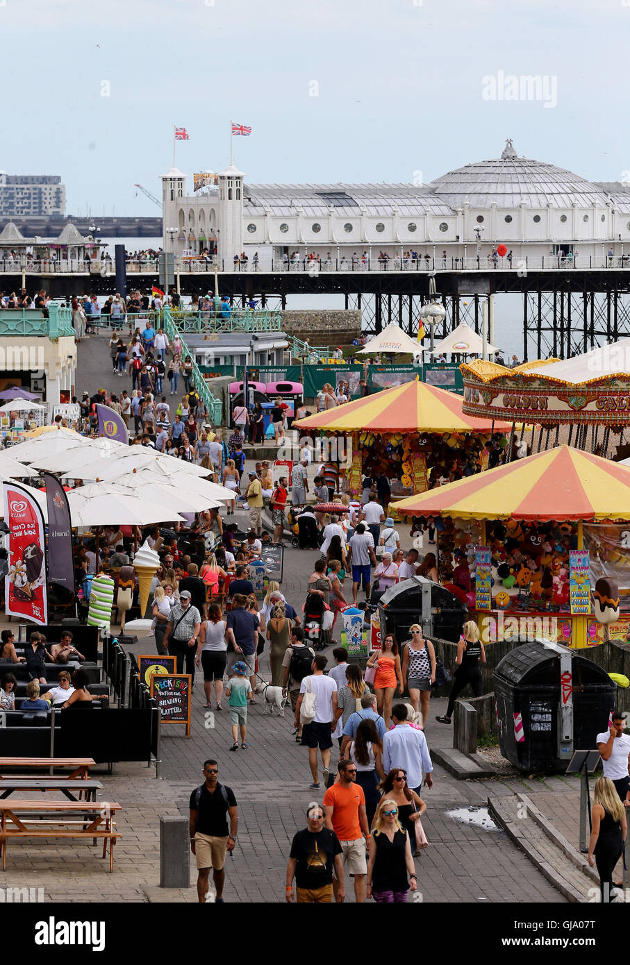 People enjoy the warm weather on the beach in Brighton, East Sussex ...