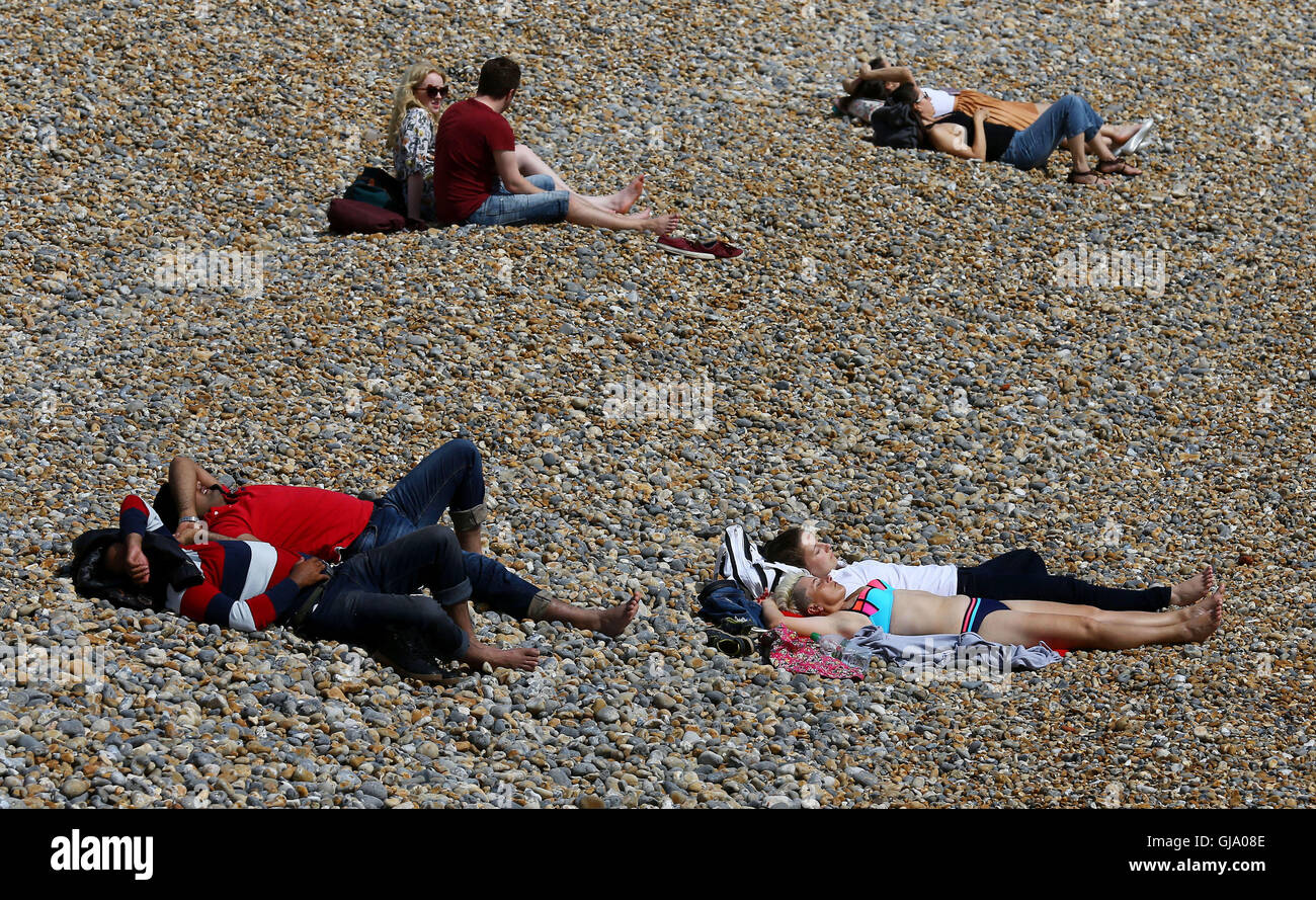 People enjoy the warm weather on the beach in Brighton, East Sussex ...