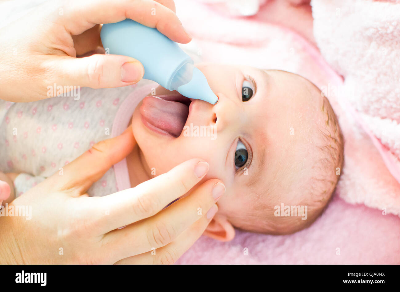 cleaning baby nose Stock Photo - Alamy