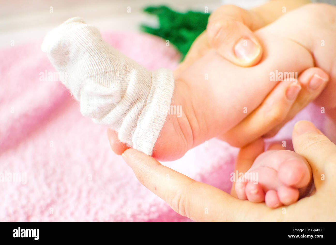 Baby wearing socks hi-res stock photography and images - Alamy