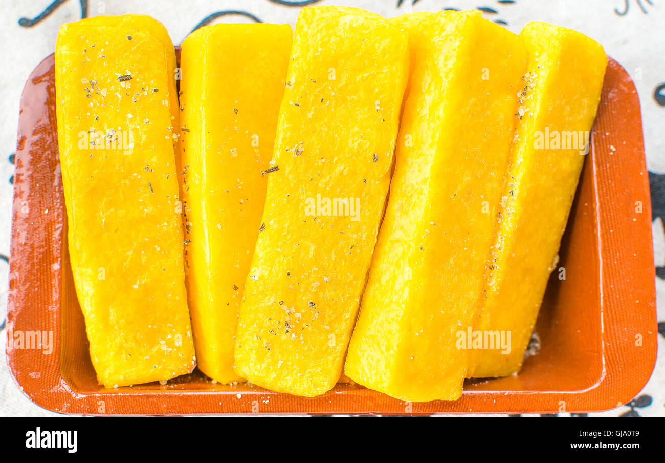 cornmeal mush slices yellow Stock Photo - Alamy