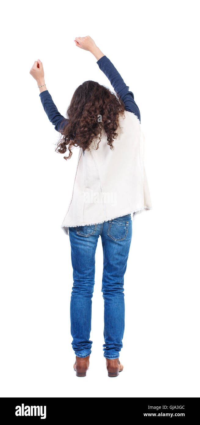 back view of dancing young beautiful woman. girl watching Stock Photo ...