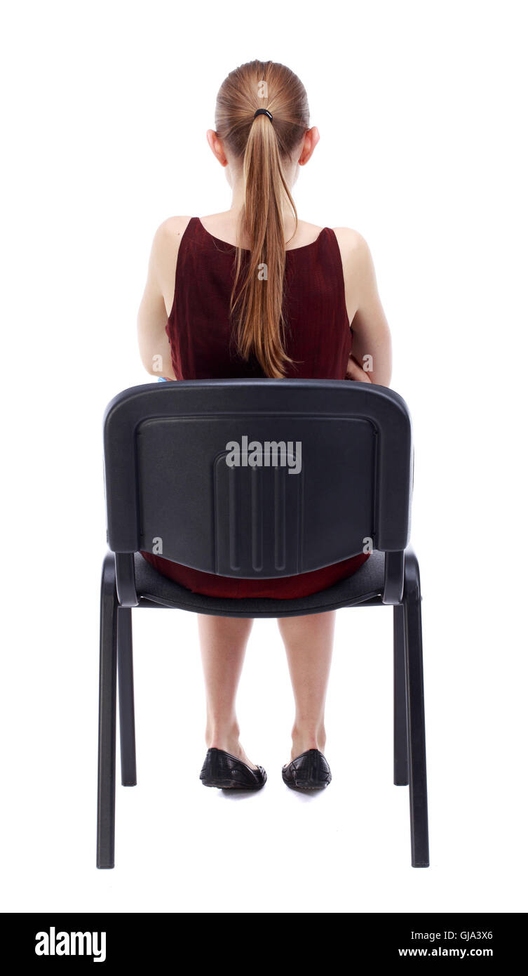 back view of young beautiful woman sitting on chair Stock Photo - Alamy