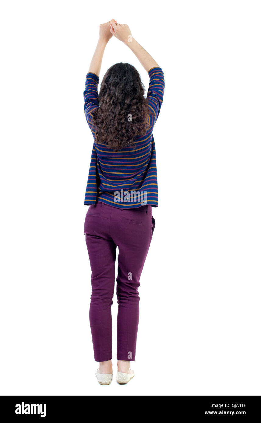 back view of dancing young beautiful woman. girl watching Stock Photo ...