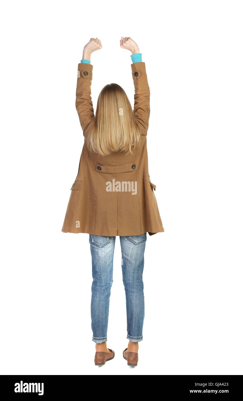 Back view of woman. Raised his fist up in victory sign Stock Photo - Alamy