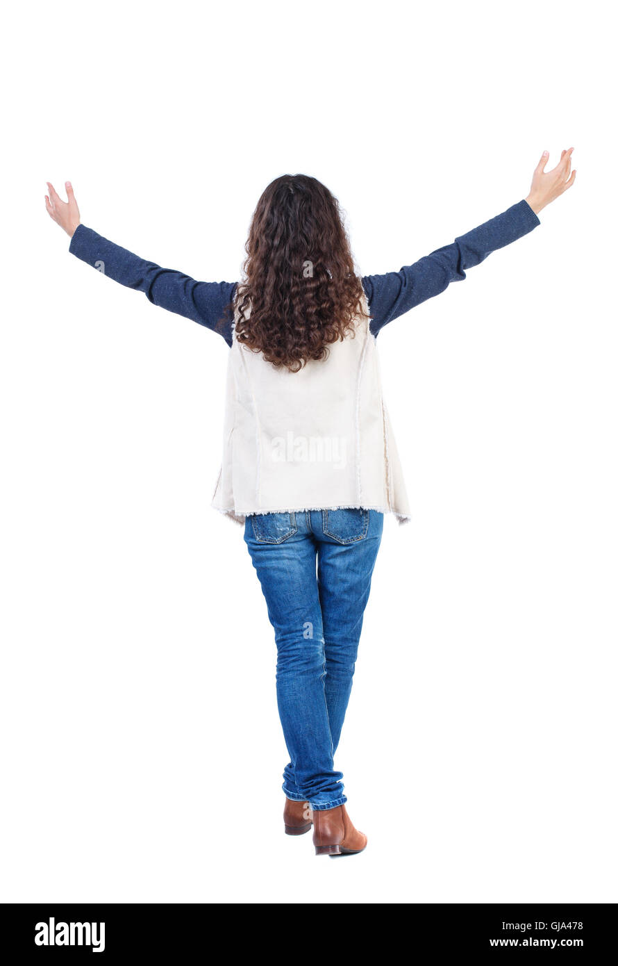 Back view of beautiful woman welcomes Stock Photo - Alamy
