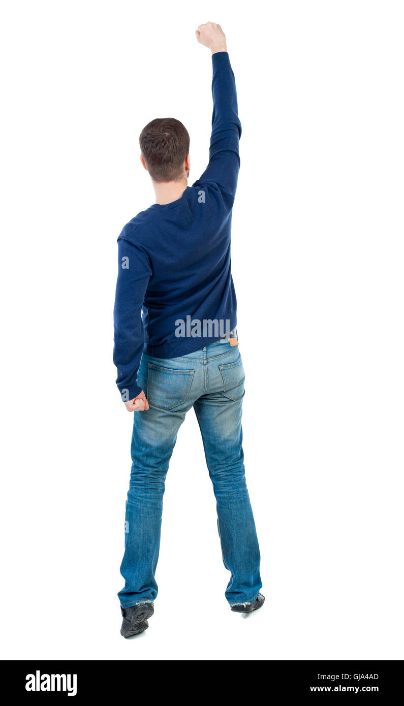 Back view of man. Raised his fist up in victory sign Stock Photo - Alamy
