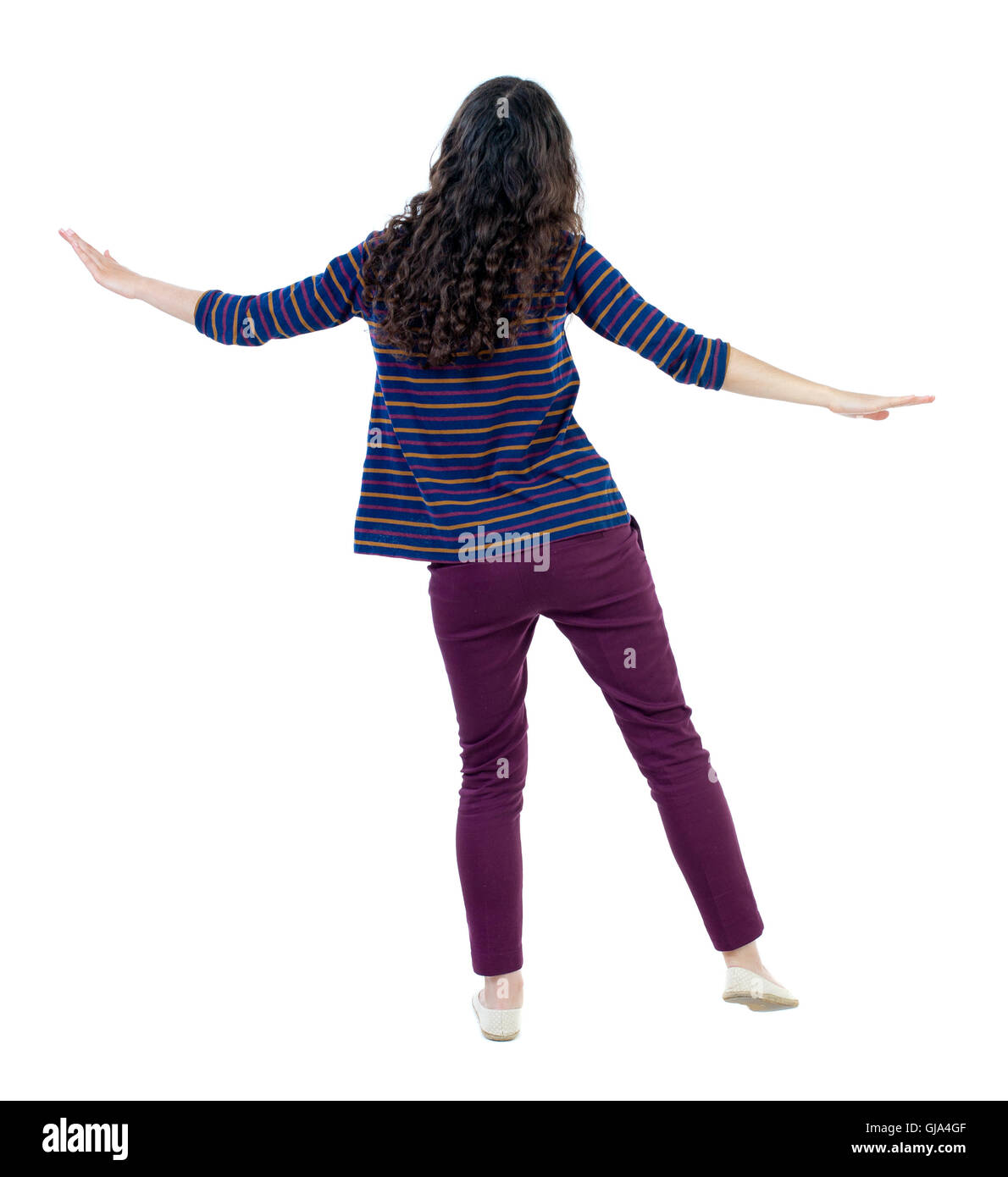 Balancing young woman Stock Photo - Alamy