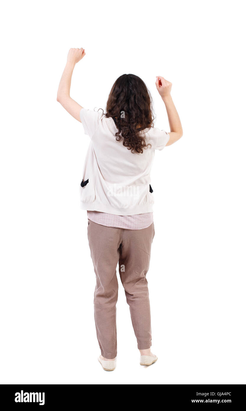 back view of dancing young beautiful woman. girl watching Stock Photo ...