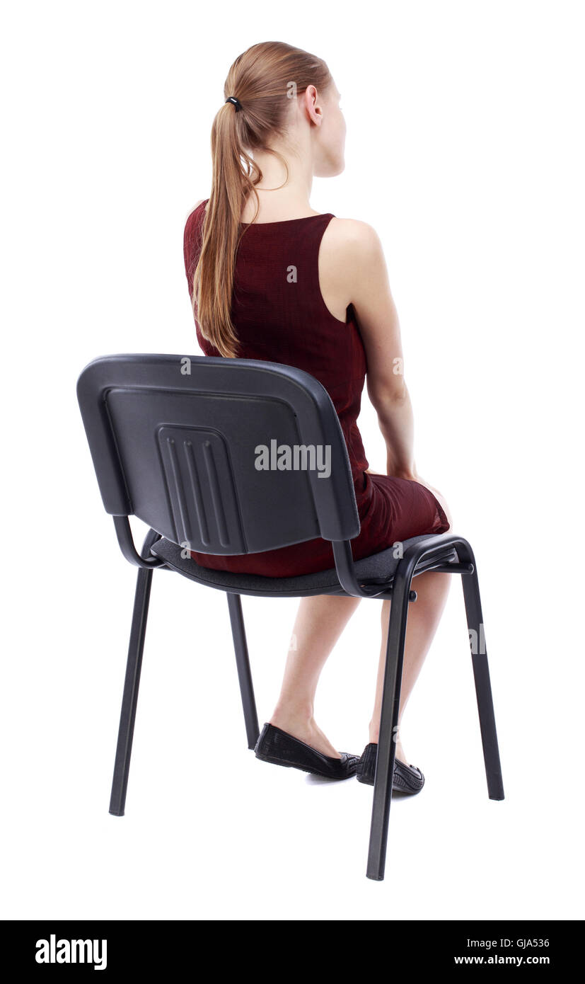 back view of young beautiful woman sitting on chair Stock Photo - Alamy