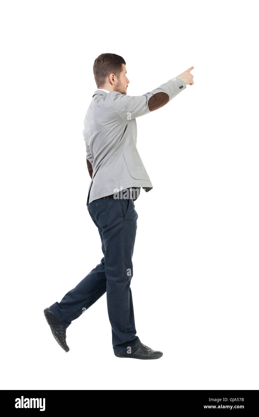 Back view of going business man pointing Stock Photo - Alamy