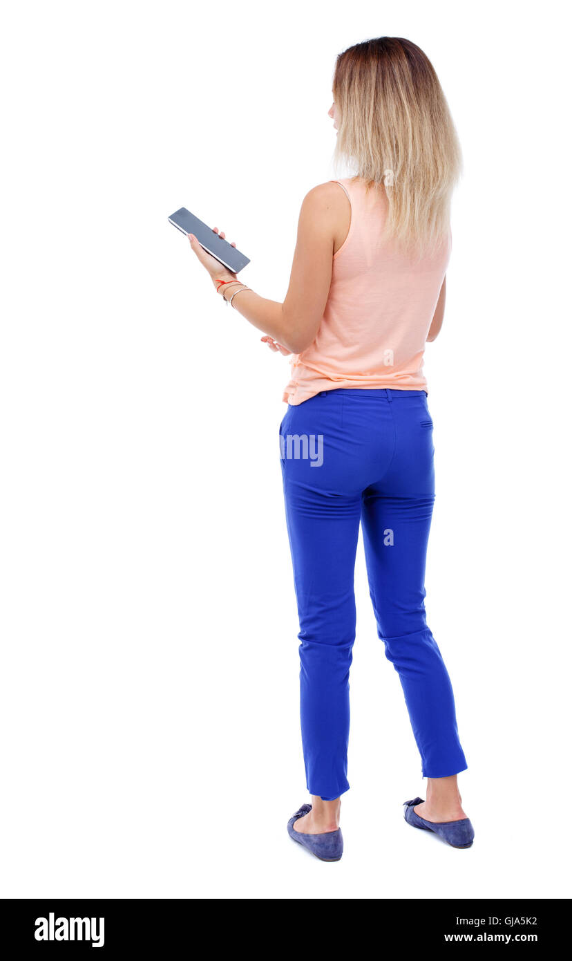 back view of standing young beautiful woman using a mobile phon Stock ...