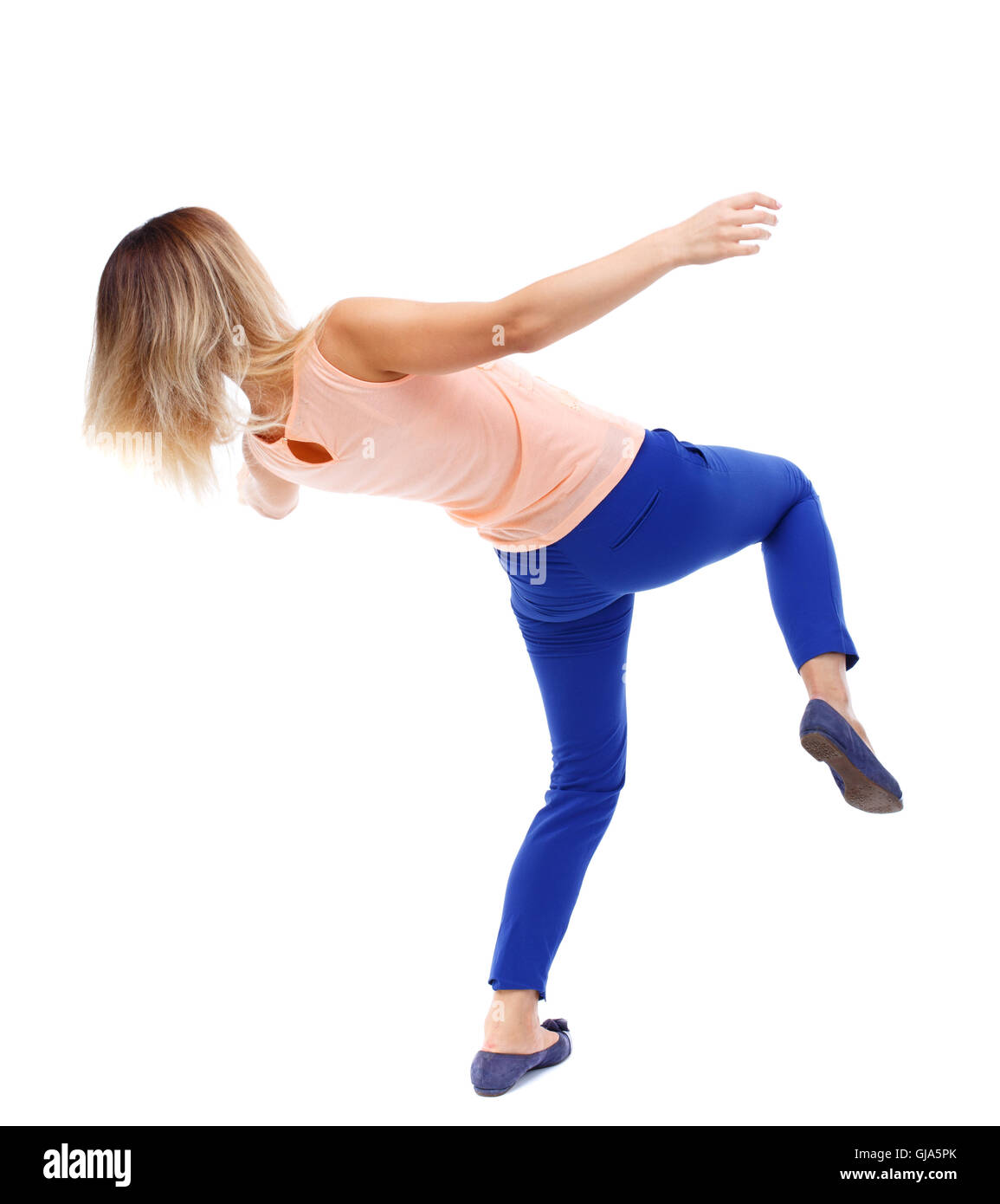 Balancing young woman Stock Photo - Alamy