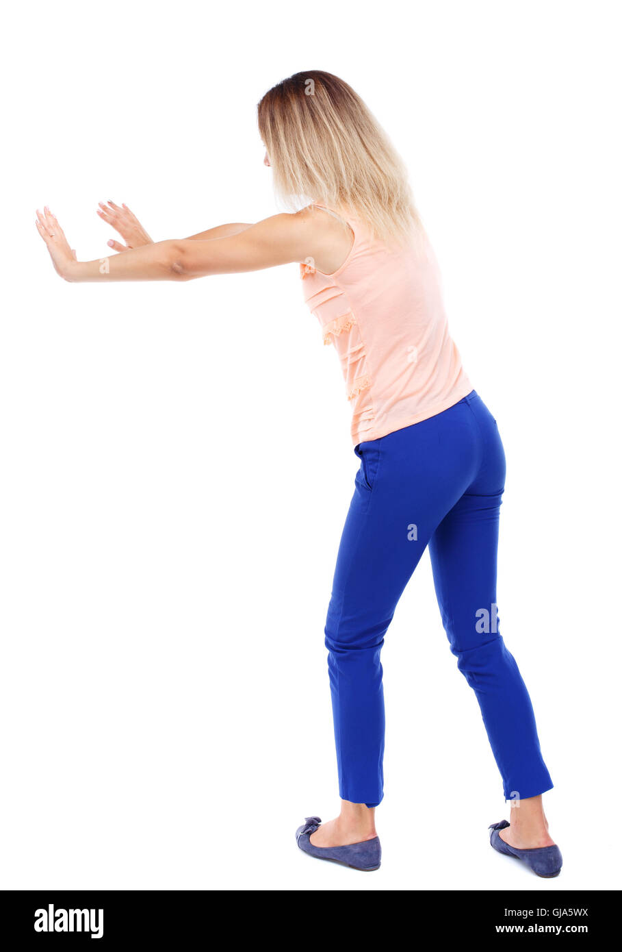 back view of woman pushes wall Stock Photo - Alamy