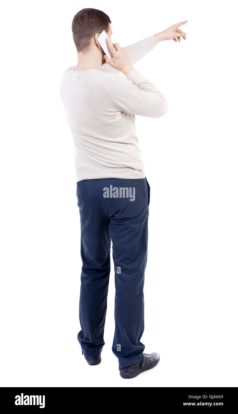 Back view of pointing young men talking on cell phone Stock Photo - Alamy
