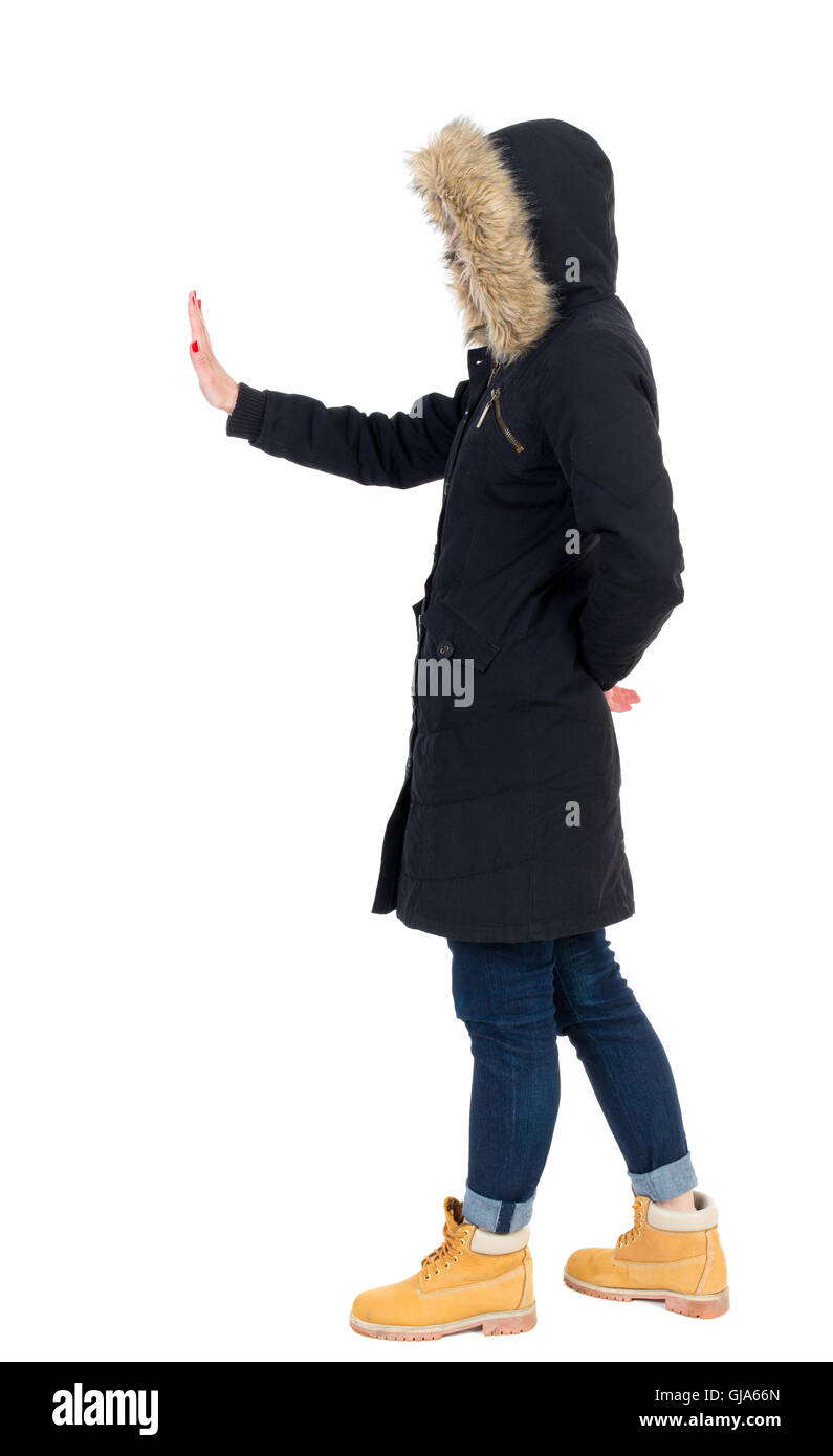 back view of woman. Young woman presses down on something Stock Photo ...
