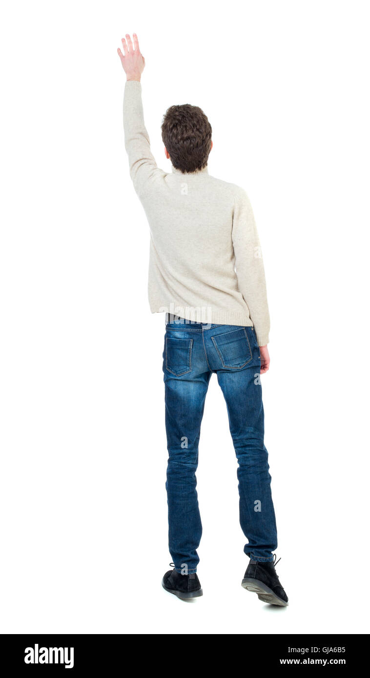 Back view of man. Raised his fist up in victory sign Stock Photo - Alamy