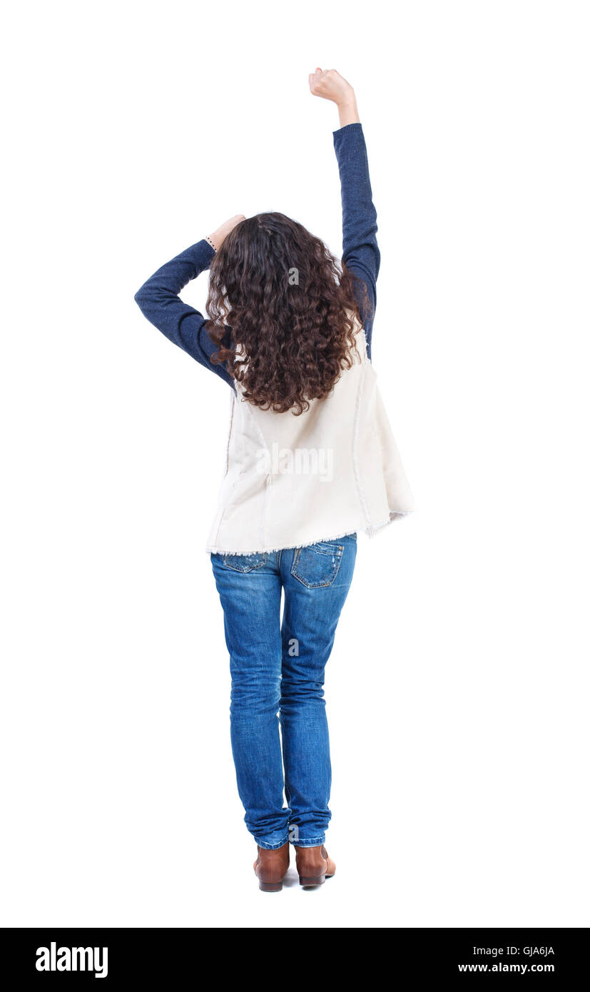 back view of dancing young beautiful woman. girl watching Stock Photo ...