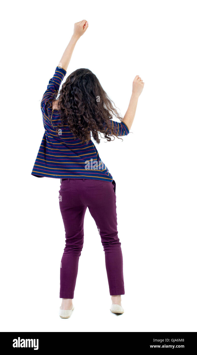 back view of dancing young beautiful woman. girl watching Stock Photo ...