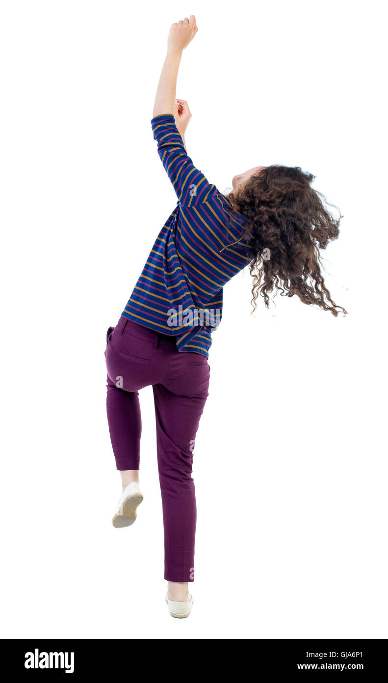 back view of dancing young beautiful woman. girl watching Stock Photo ...