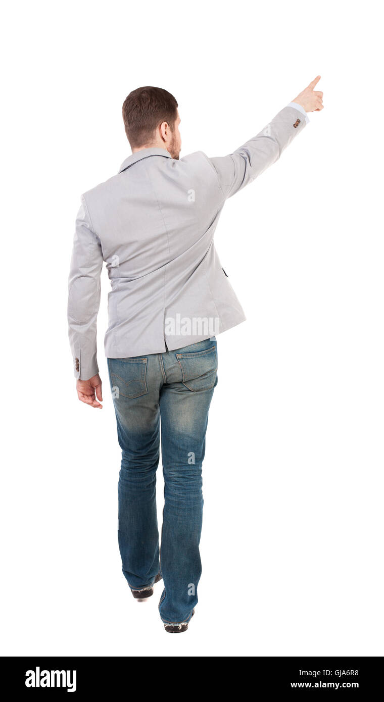 Back view of going business man pointing Stock Photo - Alamy